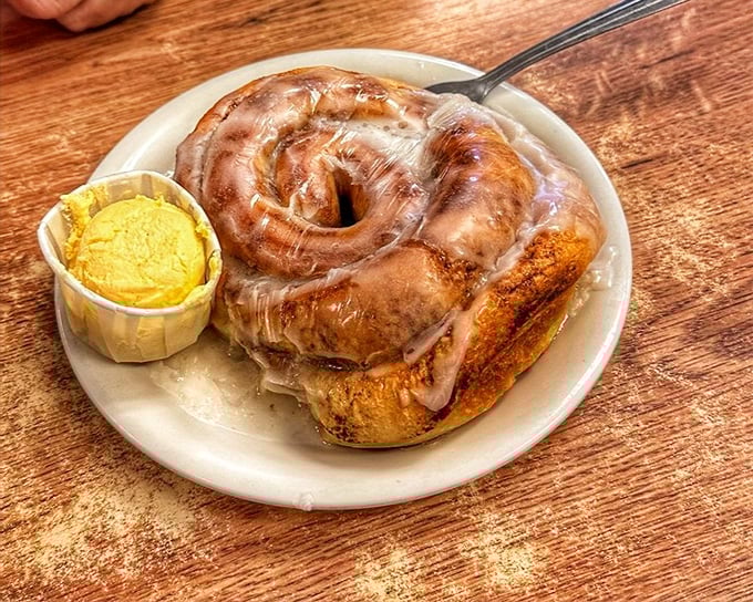 A cinnamon roll that's clearly been working out. That spiral of cinnamon, sugar, and butter doesn't just satisfy hunger—it recalibrates your definition of breakfast joy.