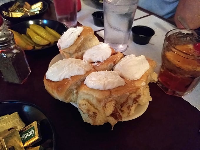 Pillowy cinnamon rolls topped with clouds of cream cheese frosting – because at a proper supper club, dessert isn't an afterthought, it's a grand finale.