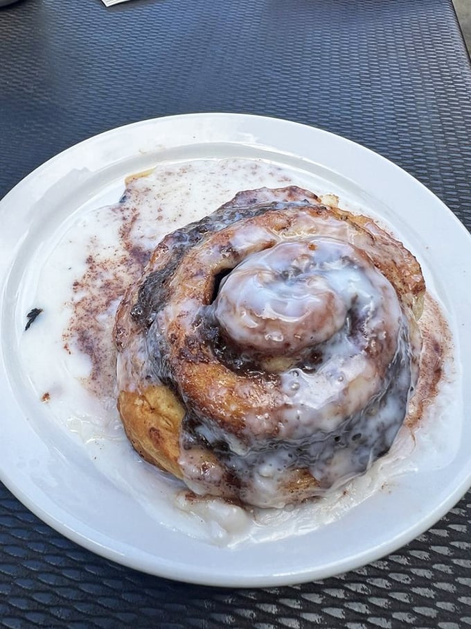This cinnamon roll isn't just dessert masquerading as breakfast—it's a spiritual experience. Gooey, warm, and absolutely worth the sticky fingers.