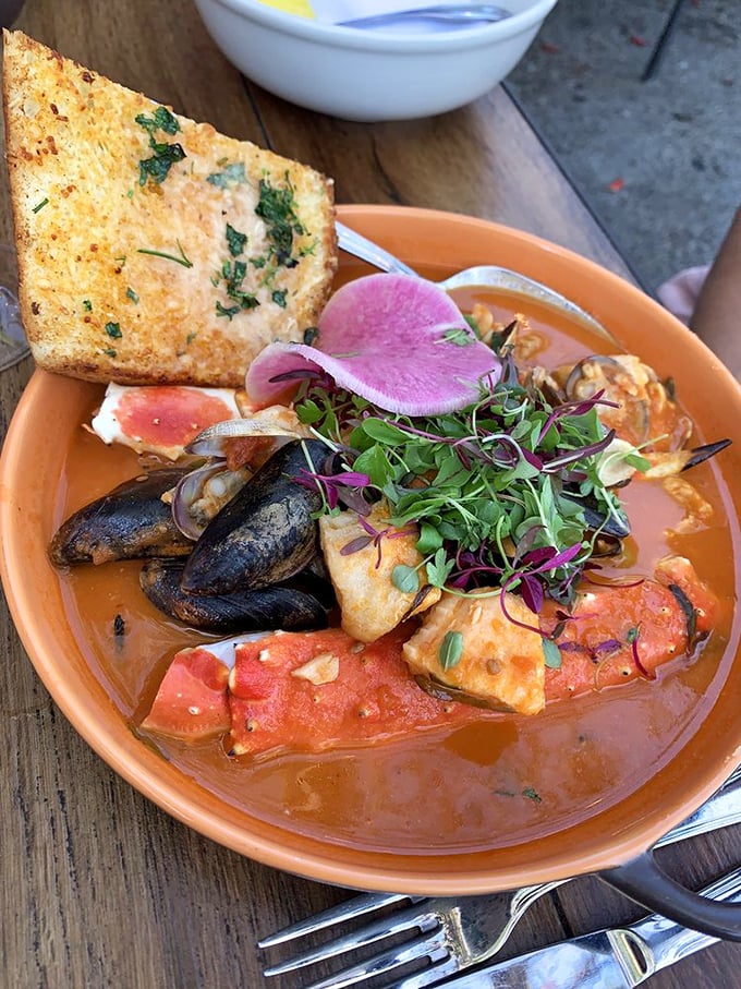 Not all heroes wear capes—some come in orange bowls with crusty bread for dipping. This cioppino is the superhero of seafood stews.