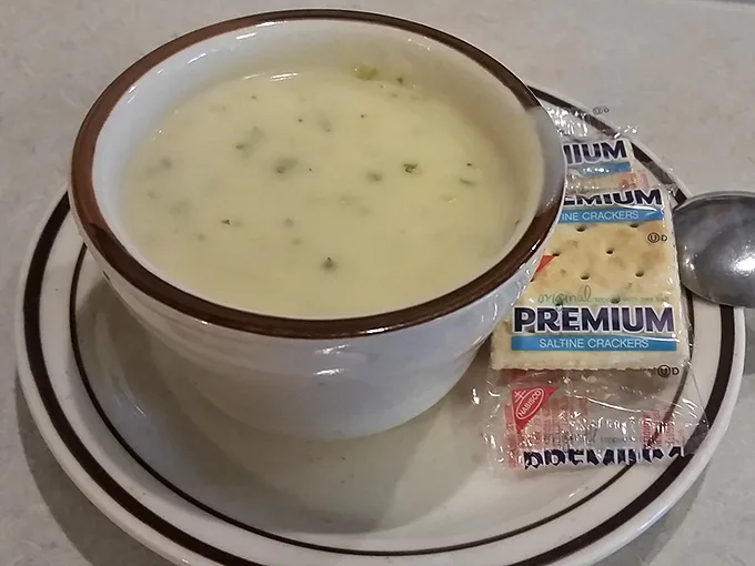 A bowl of clam chowder so comforting it could end family feuds—served with crackers that are merely a formality.