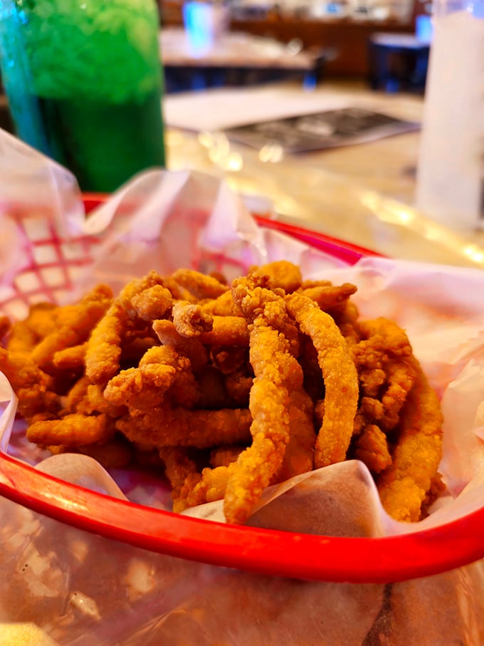 Golden-fried clam strips that crunch like your favorite childhood memory. The basket they're served in is just a formality—they won't last long.