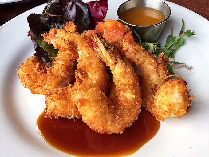 These coconut shrimp have achieved the perfect crunch-to-juiciness ratio—the culinary equivalent of hitting the lottery on your first try.