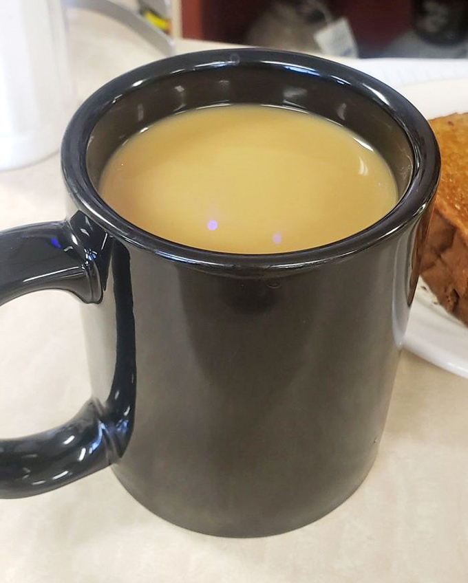 Coffee served in a sturdy mug that means business. This isn't some fancy latte art situation—this is the fuel that's powered Ohio mornings for generations. 