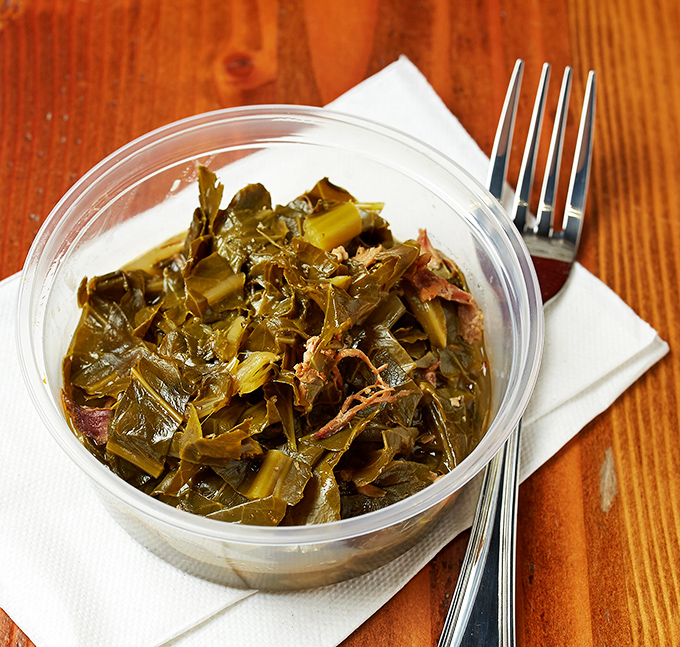 These aren't your cafeteria collard greens. Slow-simmered with smoky bits of pork, they're the side dish that steals the spotlight.