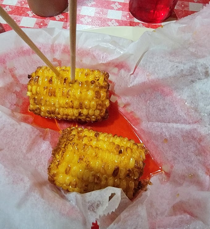 Corn on the cob that's been kissed by fire and skewered for your convenience. Summer on a stick, no matter what month it is.