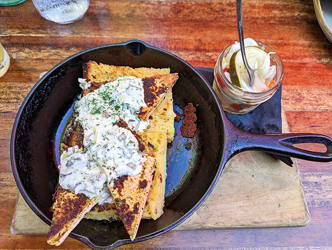This cornbread stack towers like edible architecture, defying gravity and common sense in delicious ways.