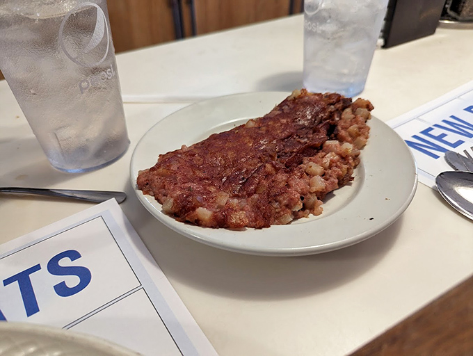 Corned beef hash that doesn't apologize for being exactly what it is—a crispy-edged, savory morning miracle that pairs perfectly with strong coffee and yesterday's regrets.