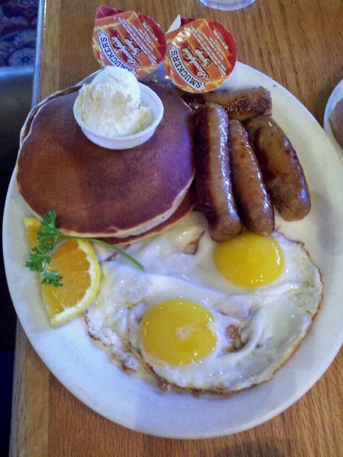 The classic American breakfast trifecta—pancakes, eggs, and sausage—executed with the confidence of a diner that knows exactly what you need.