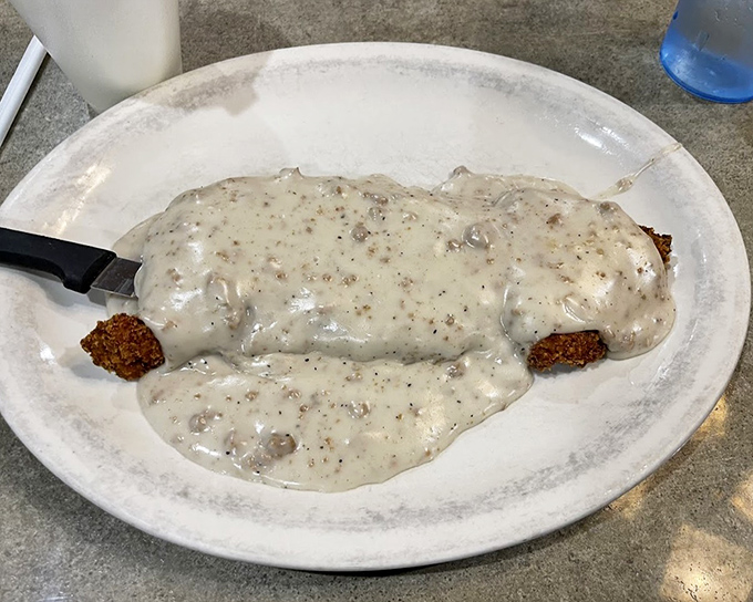 Country fried steak swimming in creamy gravy—comfort food that hugs you from the inside. Your diet can start tomorrow.