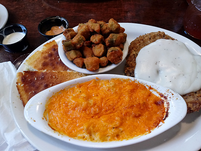 A plate that screams "Southern comfort"—mac and cheese that's traveled to heaven and back, alongside crispy okra and cornbread worth fighting over.