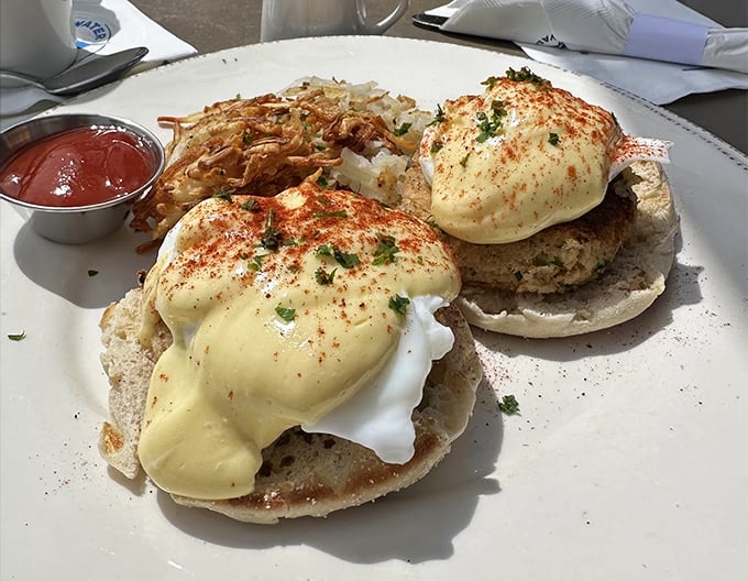 Crab cake benedict: where breakfast meets the ocean and decides to throw a party. Those hollandaise-draped beauties are what breakfast dreams are made of.