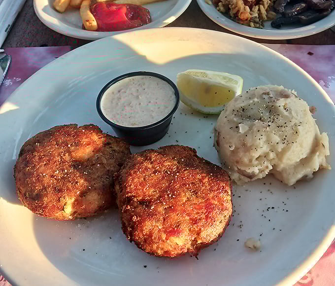 These crab cakes are what happens when someone respects the crab—minimal filler, maximum flavor, and a golden crust that deserves its own trophy.