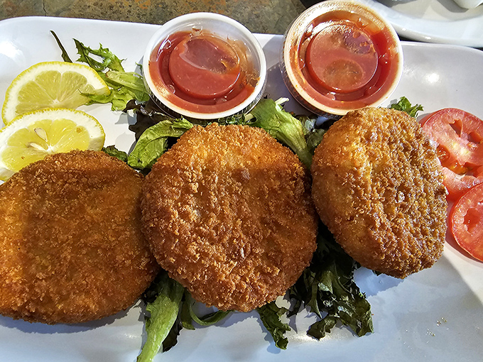 Golden-fried crab cakes that crunch like autumn leaves. The dipping sauce isn't just an option—it's the perfect dance partner for these crispy delights. 