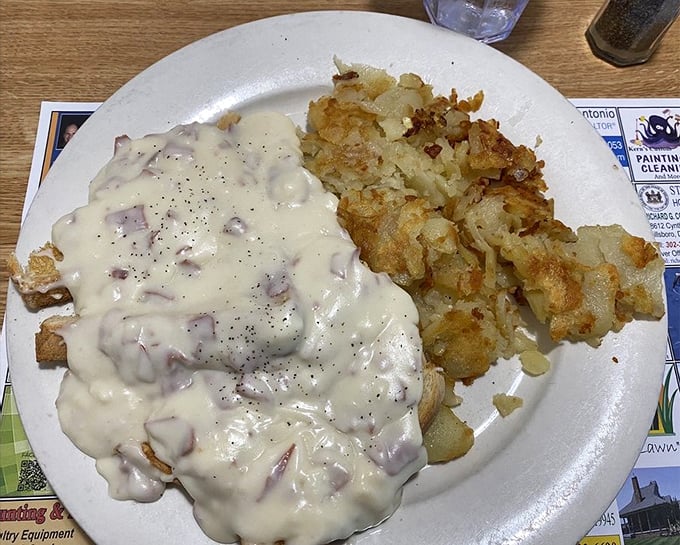 Cream chipped beef: the dish that launched a thousand childhood memories, served alongside home fries that achieve that perfect crispy-to-fluffy ratio.
