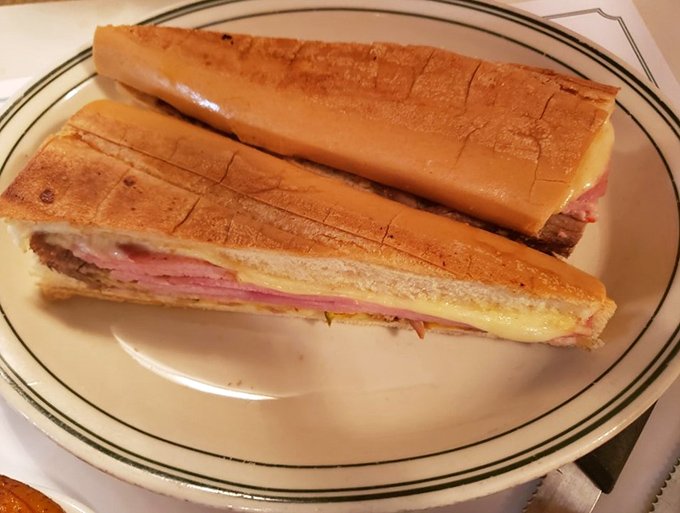 The Cuban sandwich – a perfectly pressed masterpiece of ham, roast pork, Swiss cheese, pickles, and mustard that's worth crossing state lines for.