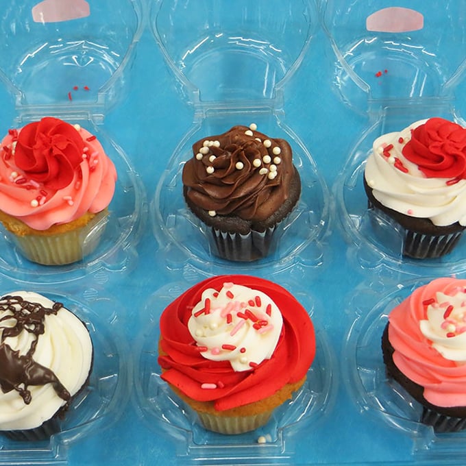 Cupcakes arranged like colorful soldiers ready for deployment to birthday parties, where they'll receive medals of honor from sticky-fingered kids.