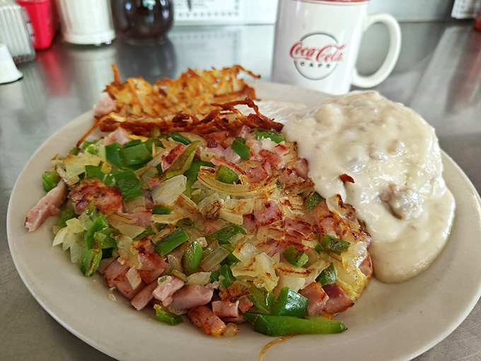 Not just any Denver omelet – this one's loaded with ham, peppers, and enough cheese to make Colorado jealous, all crowned with crispy hash browns.
