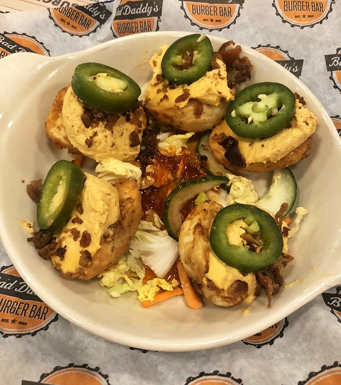 Deviled eggs get a Bad Daddy's makeover with jalapeños on top—proof that even appetizers deserve their moment in the spotlight.