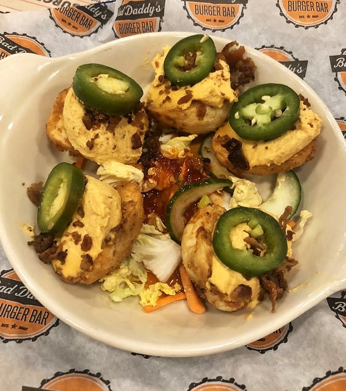 Deviled eggs get a Bad Daddy's makeover with jalapeños on top—proof that even appetizers deserve their moment in the spotlight.