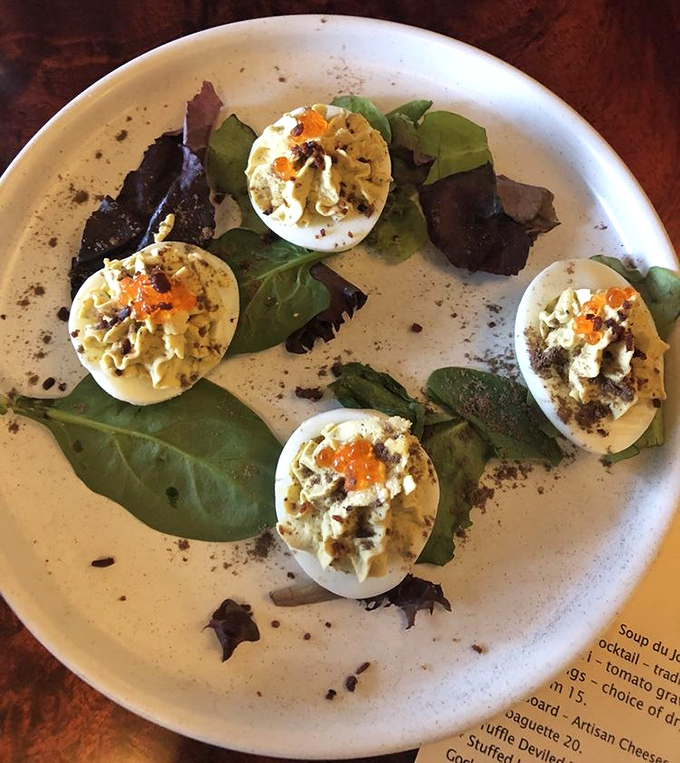 Deviled eggs elevated from picnic staple to culinary statement. Those little orange pearls of roe are the jewelry this dish deserves.