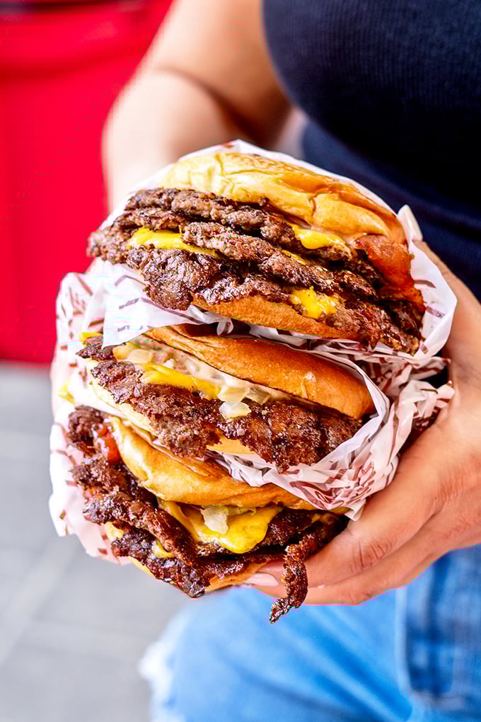 The triple burger—where "too much of a good thing" proves to be exactly the right amount of a great thing.