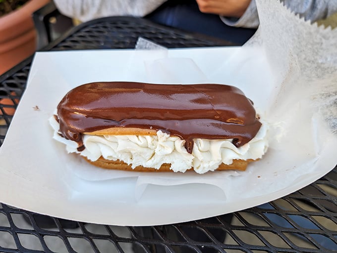 The chocolate éclair—where French technique meets Danish hospitality, resulting in a cream-filled masterpiece that makes you forget about your diet plans entirely.