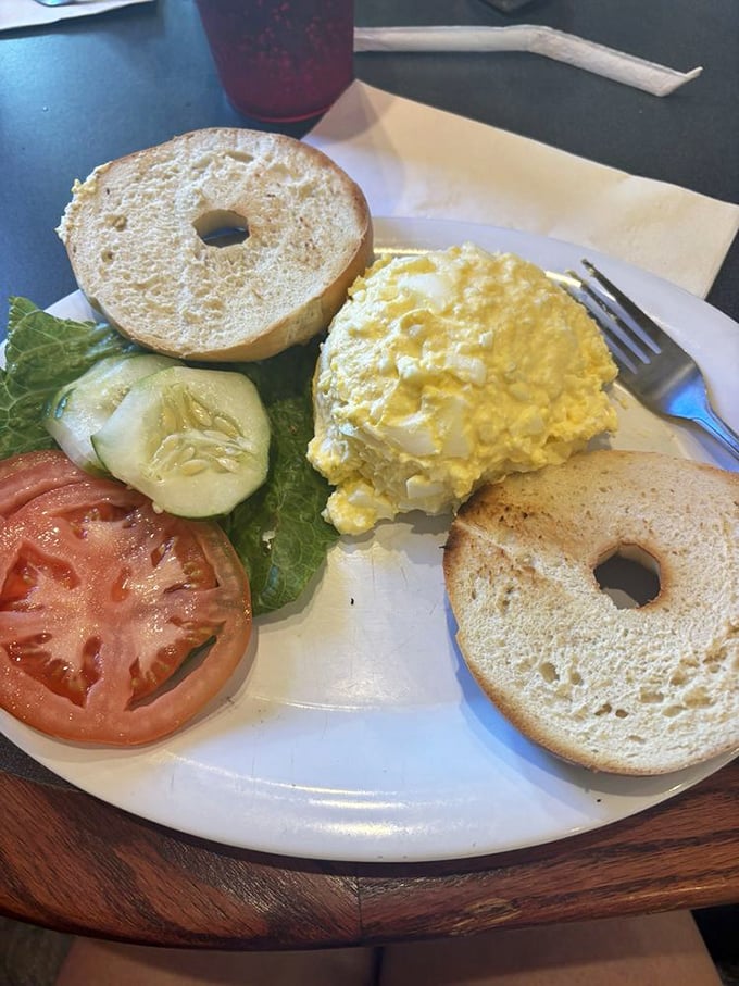 The egg salad bagel platter—where simplicity meets perfection. Fresh veggies standing by, ready to join this creamy, protein-packed party.