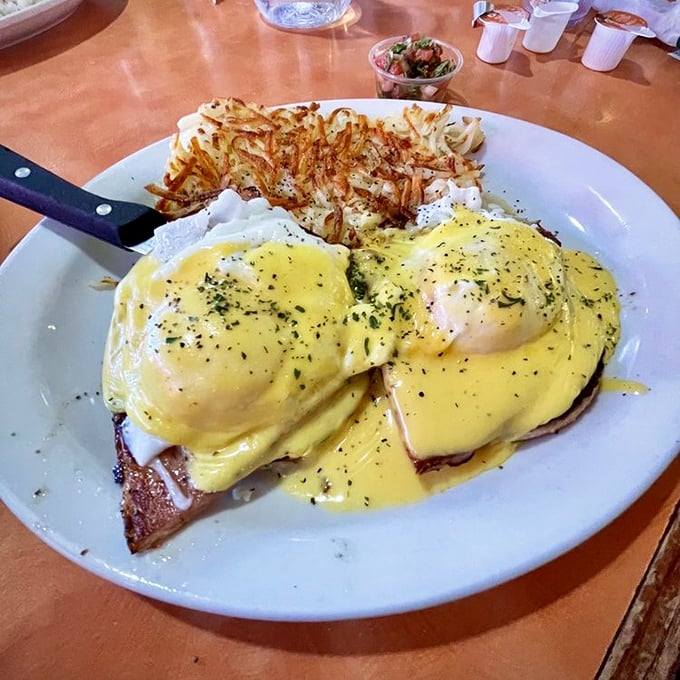 Eggs Benedict done right, with hollandaise so smooth it practically sings opera while sliding off your fork gracefully.