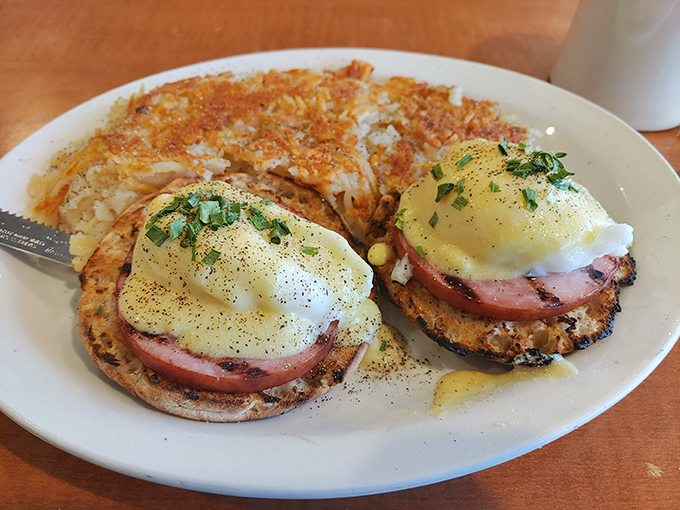 Eggs Benedict: where hollandaise meets Canadian bacon in a breakfast rendezvous that makes Monday mornings bearable again. Those hash browns don't hurt either.