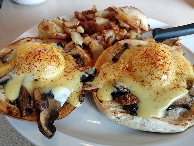Eggs Benedict reimagined with mushrooms instead of Canadian bacon – a vegetarian plot twist worthy of an M. Night Shyamalan breakfast film.