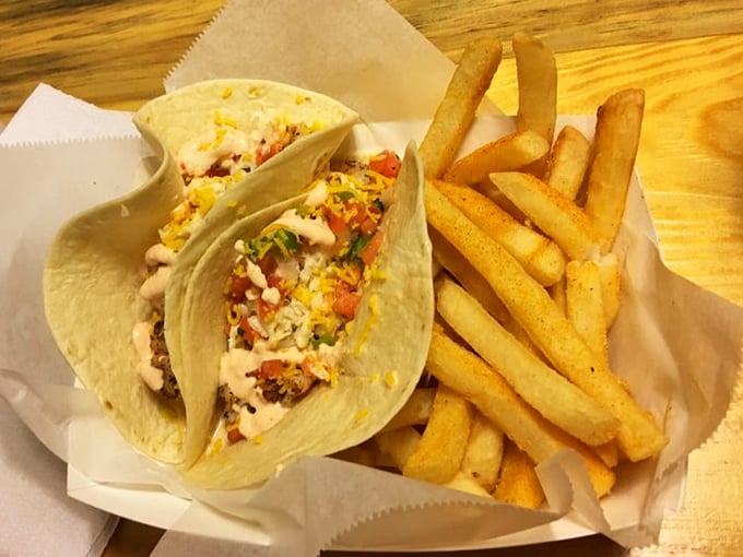 Fish tacos that make you question why you ever ate anything else. Fresh, vibrant, and served with fries that could start their own fan club.