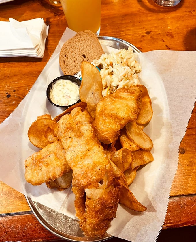 Fish so perfectly golden it belongs in Fort Knox. Coleslaw and bread: the supporting actors who deserve their own spinoff show.