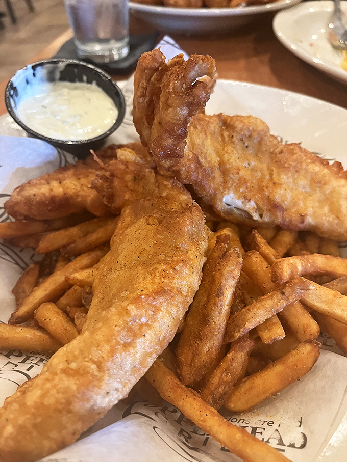 Fish and chips that crack and crunch in all the right places, with fish so tender it practically swims to your fork.