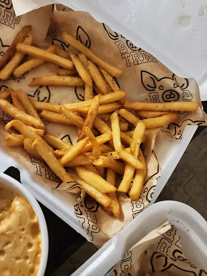 Golden fries seasoned to perfection – because even the sides deserve star treatment at this joint.