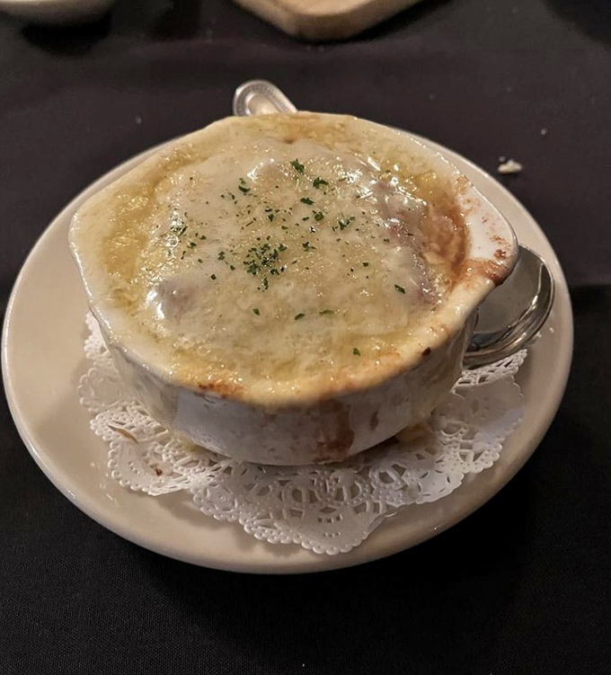 French onion soup with a cheese cap so magnificent it deserves its own national anthem. Digging through that gooey barrier is life's simple pleasure.