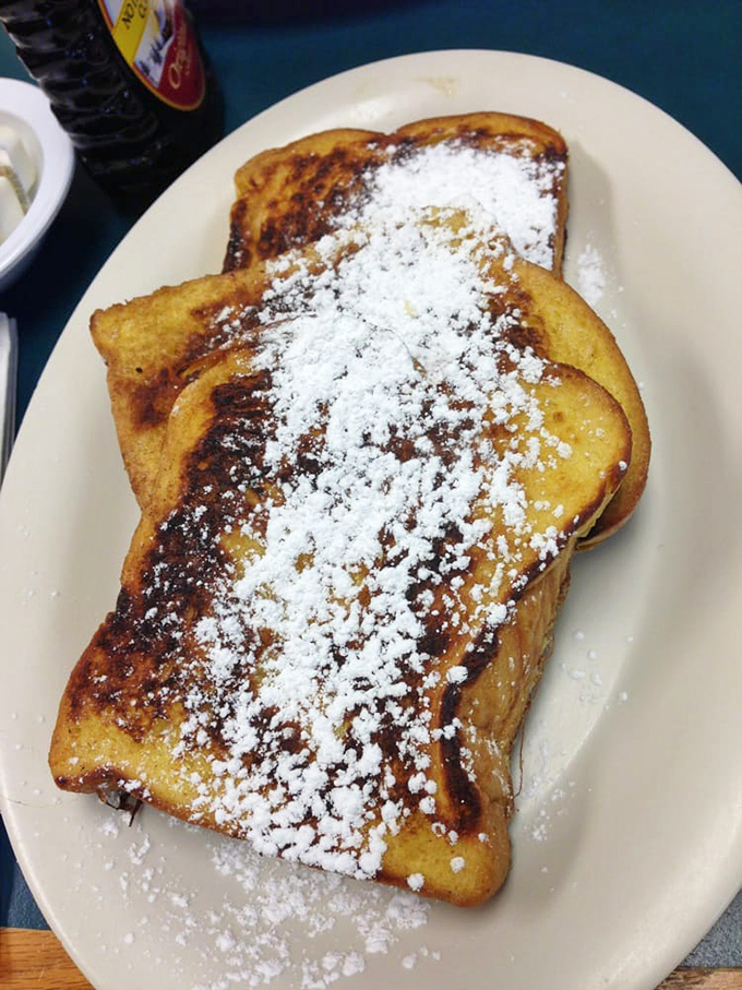 French toast that's been dipped, griddled, and dusted to perfection—proof that bread can indeed achieve its highest calling in life.