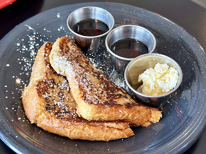 The legendary French toast in all its glory. Golden-brown perfection with that dusting of powdered sugar that makes mornings worth facing.