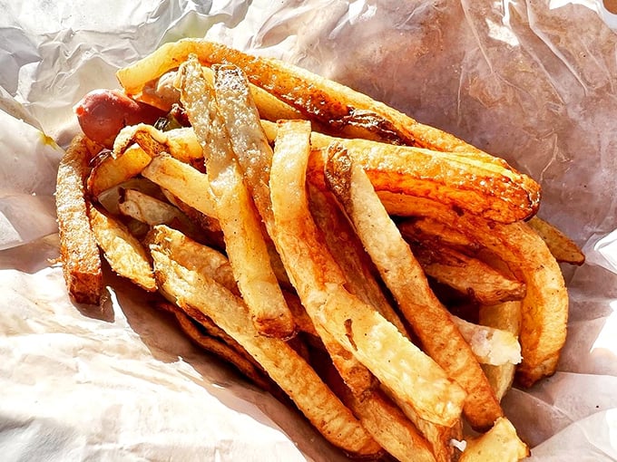 These hand-cut fries aren't just a side dish—they're the supporting actors that sometimes steal the show from the hot dog headliner.
