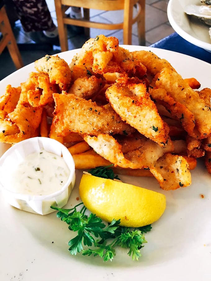 Calamari that defies the rubber-band reputation of lesser versions. These golden morsels are the Goldilocks of fried seafood – just right in every way.