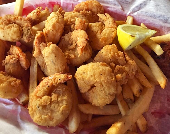 These golden-battered shrimp aren't just fried, they're elevated to art form – crispy treasures that snap between your teeth.
