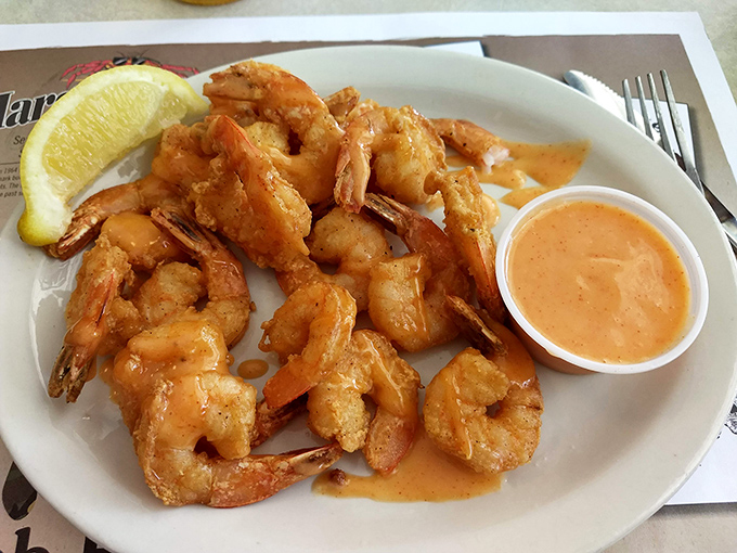 The legendary fried shrimp – perfectly golden, impeccably crisp, served with a sauce that makes you wonder why you'd eat shrimp any other way.