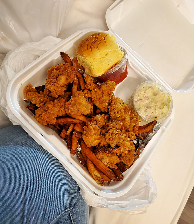 This isn't just a seafood platter—it's a Maryland vacation in styrofoam. The sweet potato fries and coleslaw provide perfect counterpoints to the crispy shrimp.