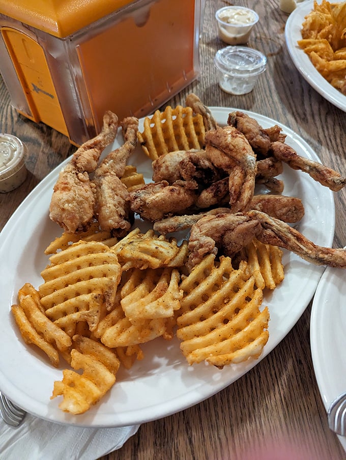 Crispy frog legs and waffle fries—proof that sometimes the most unexpected menu items become the conversation starters you can't stop talking about.