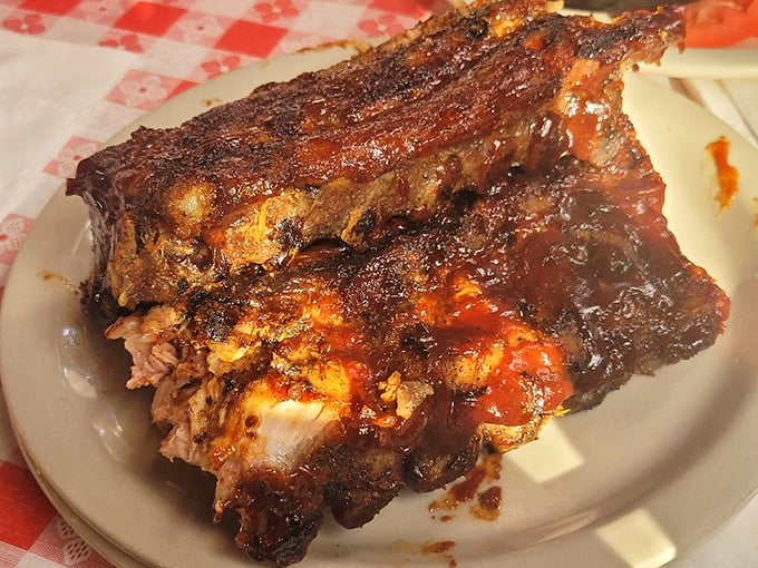 These ribs don't just fall off the bone—they practically leap into your mouth, wearing their caramelized BBQ badge of honor.