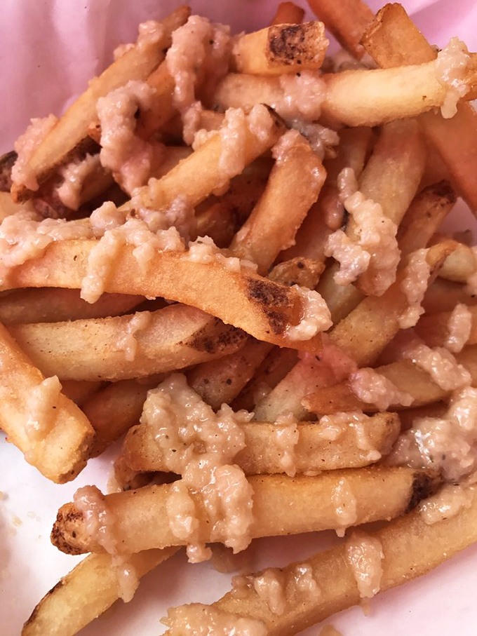 The infamous garlic fries that launched a thousand breath mints. Worth every pungent, golden, garlicky bite—just don't plan any close-talking afterward.