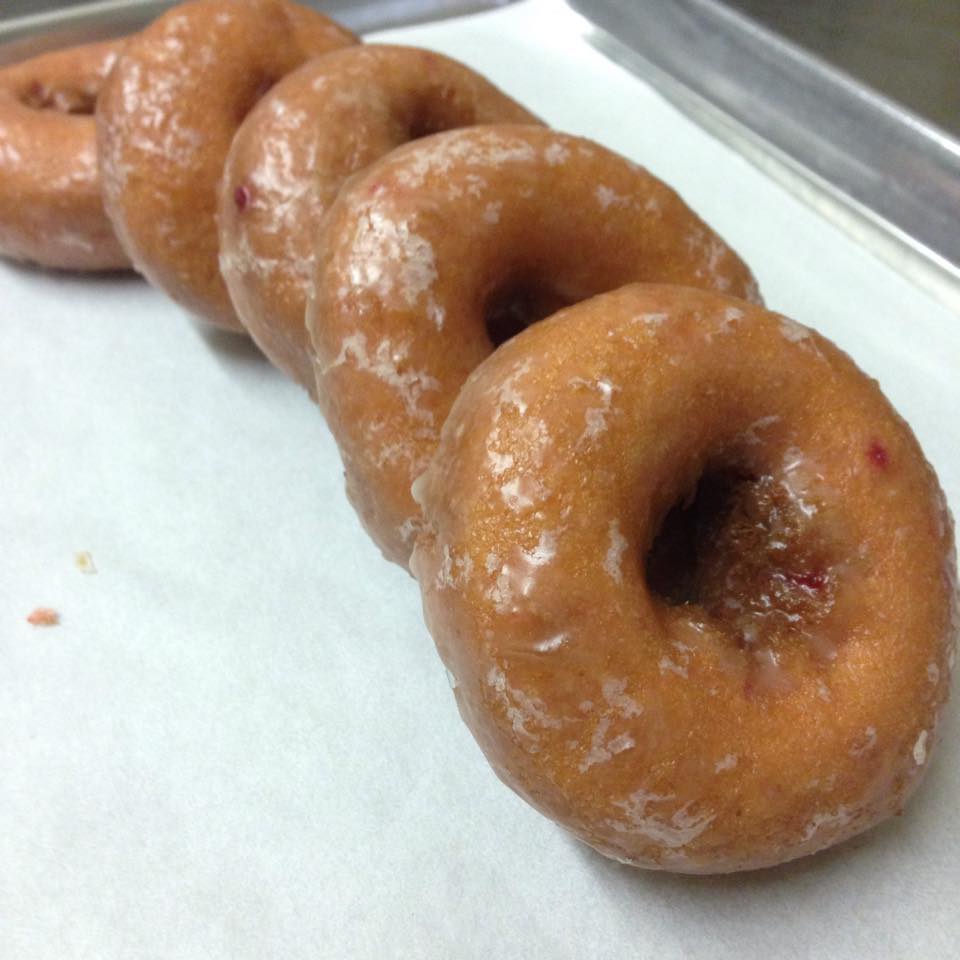 The humble glazed donut, perfected. These golden rings aren't just breakfast—they're edible halos that make Monday mornings bearable again.
