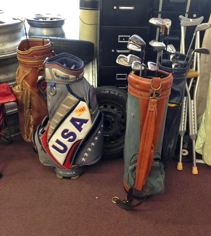 Golf bags waiting for their second swing at life. That USA bag has probably seen more courses than most weekend warriors ever will.