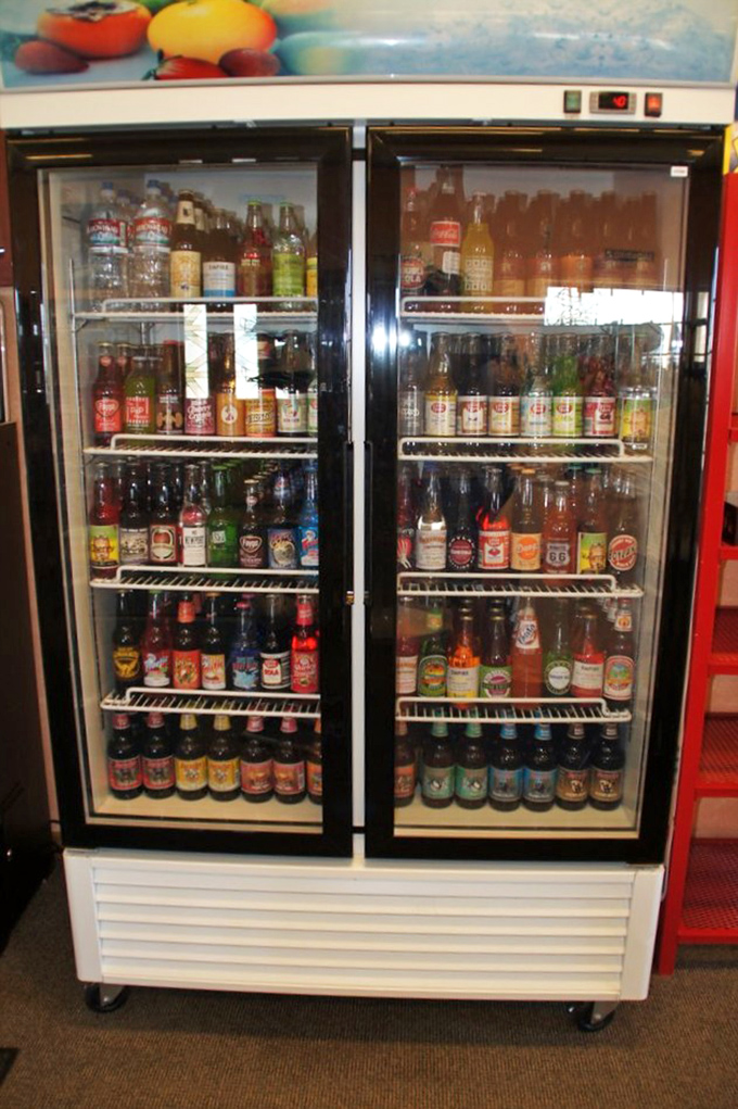 A treasure trove of bottled nostalgia—where sodas you haven't seen since childhood wait patiently in refrigerated rows.