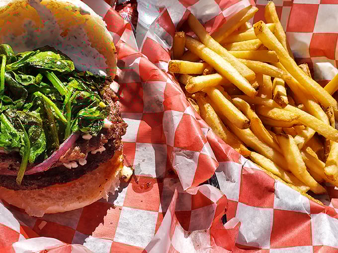Fresh ingredients elevate this burger beyond fast food territory. Those hand-cut fries aren't just sides—they're co-stars in this culinary production.